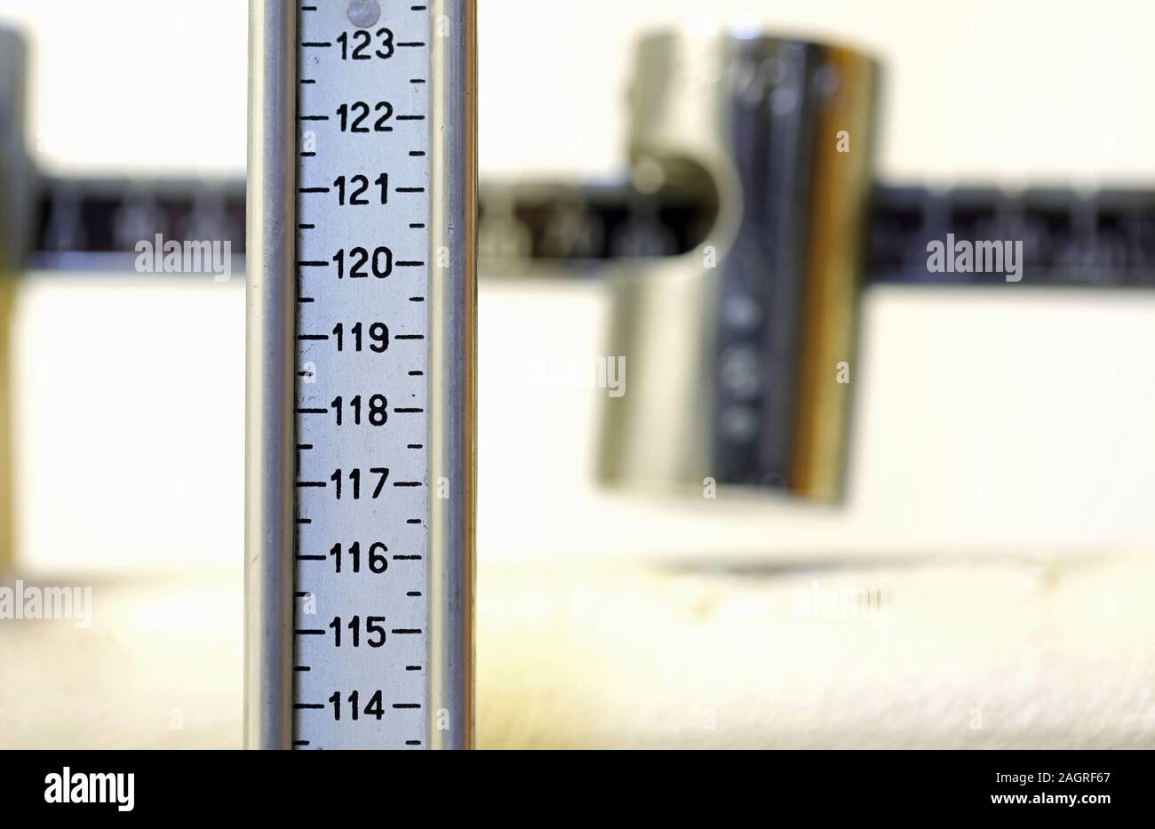 detail of graduated rod of an old weight scale in the medical clinic ...