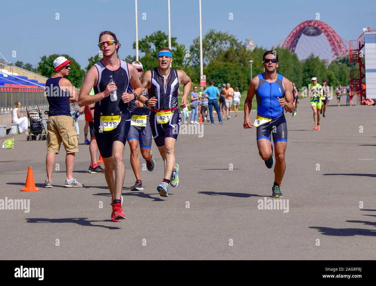 Men of different ages run a marathon. Clear Sunny summer day Stock ...