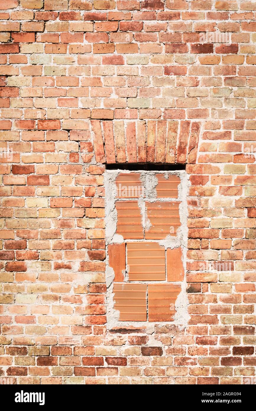 Front view of brick building, walled window Stock Photo - Alamy