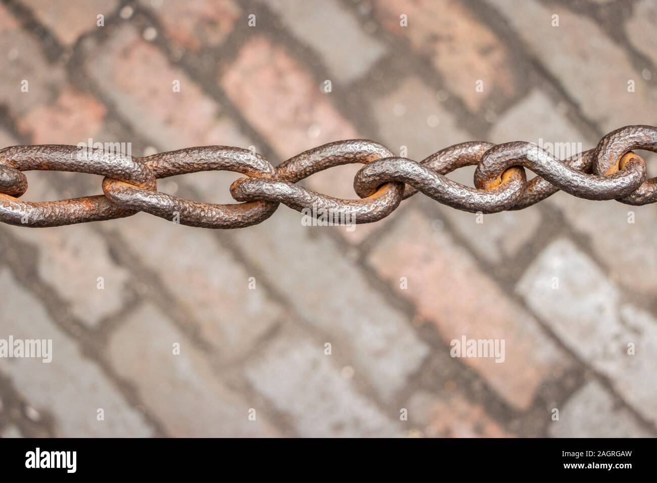 rusty old cast iron chain in a forge at the Black Country Living Museum ...