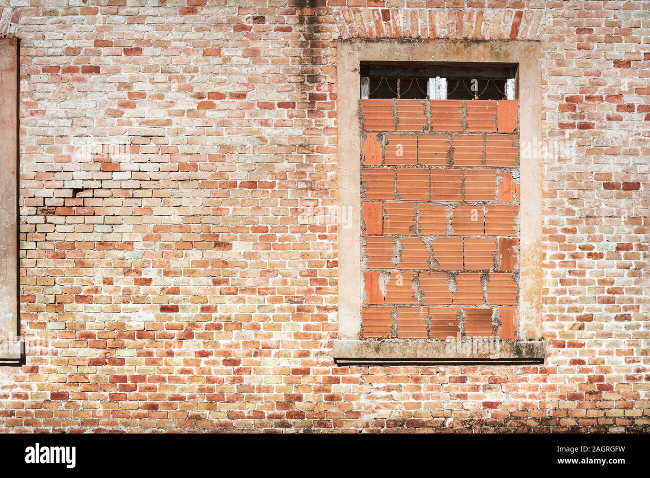 Front view of brick building, walled window Stock Photo - Alamy