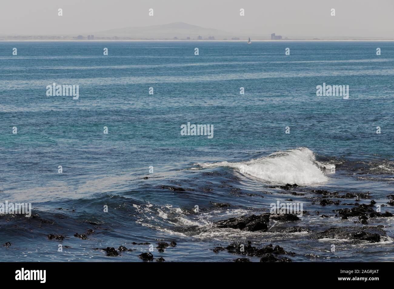 Deep blue water with waves at the Sea Point, beach promenade in Cape ...