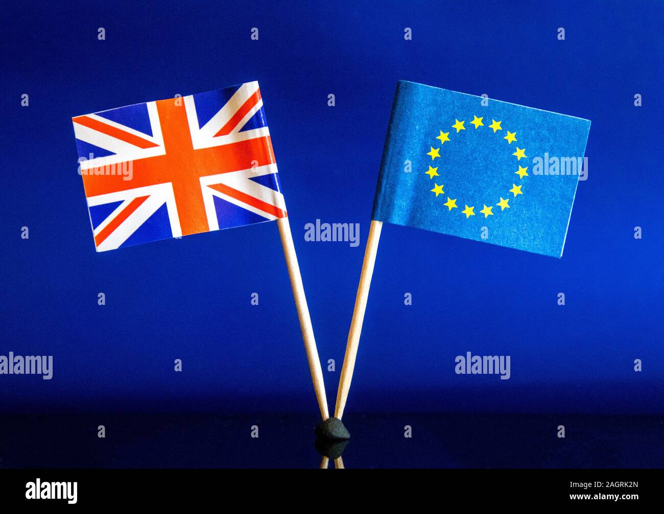 The British and EU flags stand together, against a sky blue background ...