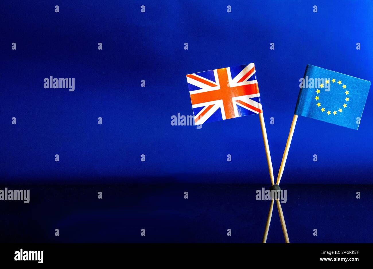 The British and EU flags stand together, against a sky blue background ...