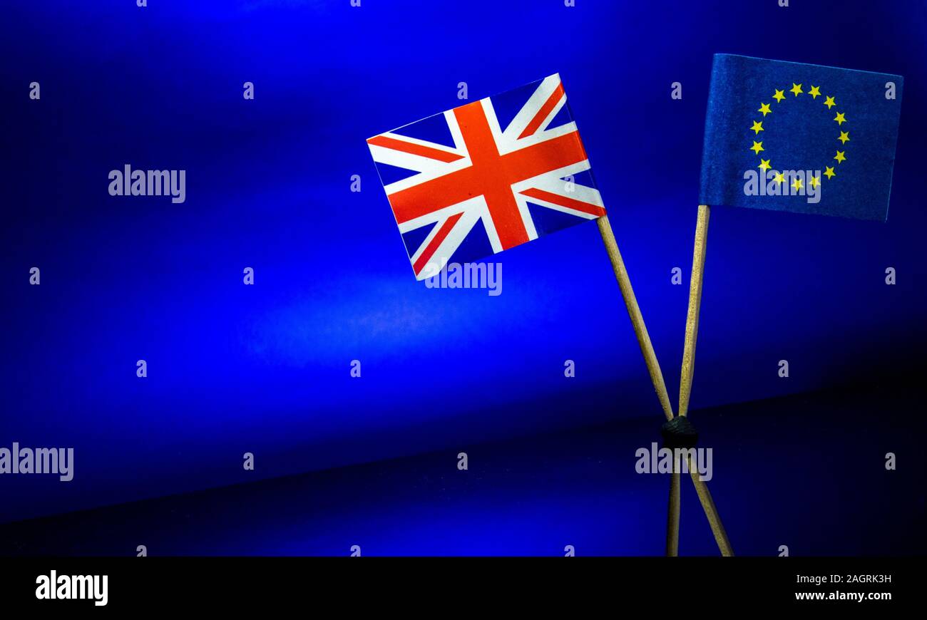 The British and EU flags stand together, against a sky blue background ...