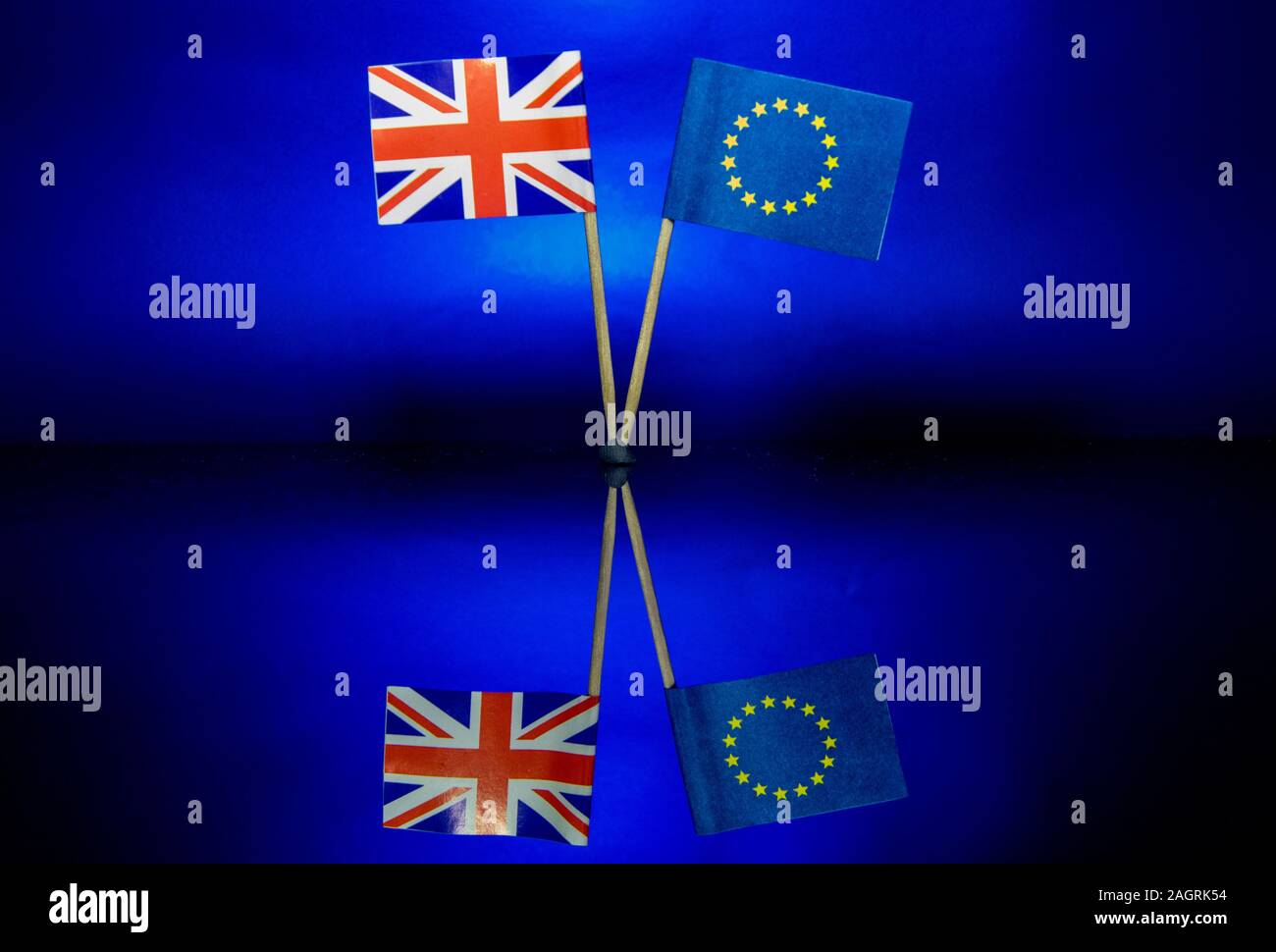 The British and EU flags stand together, against a sky blue background ...