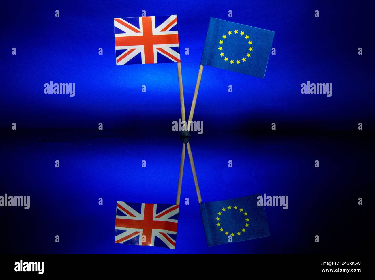 The British and EU flags stand together, against a sky blue background ...