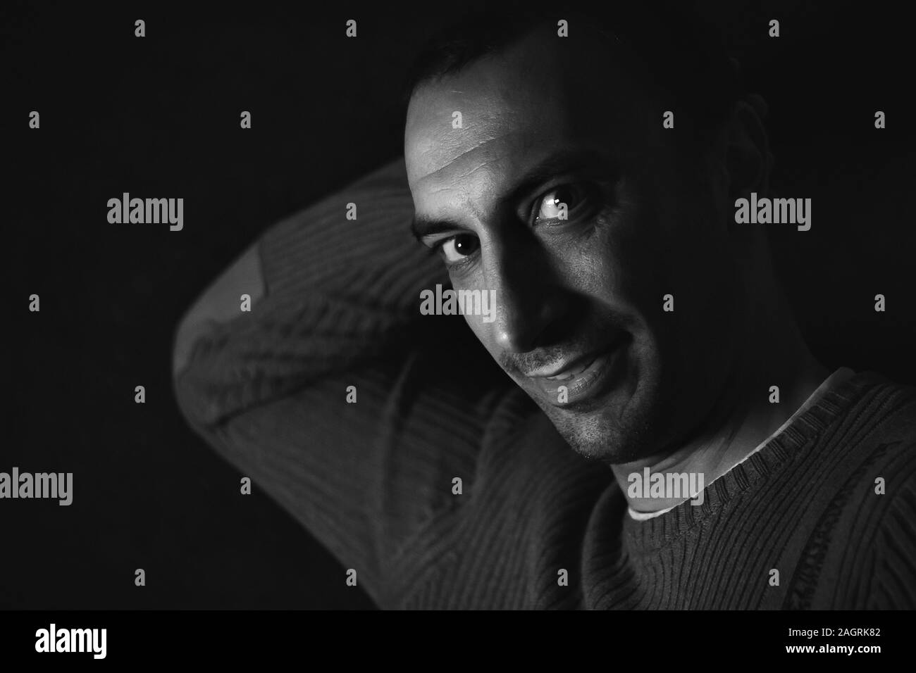 Portrait of a man, black background Stock Photo - Alamy