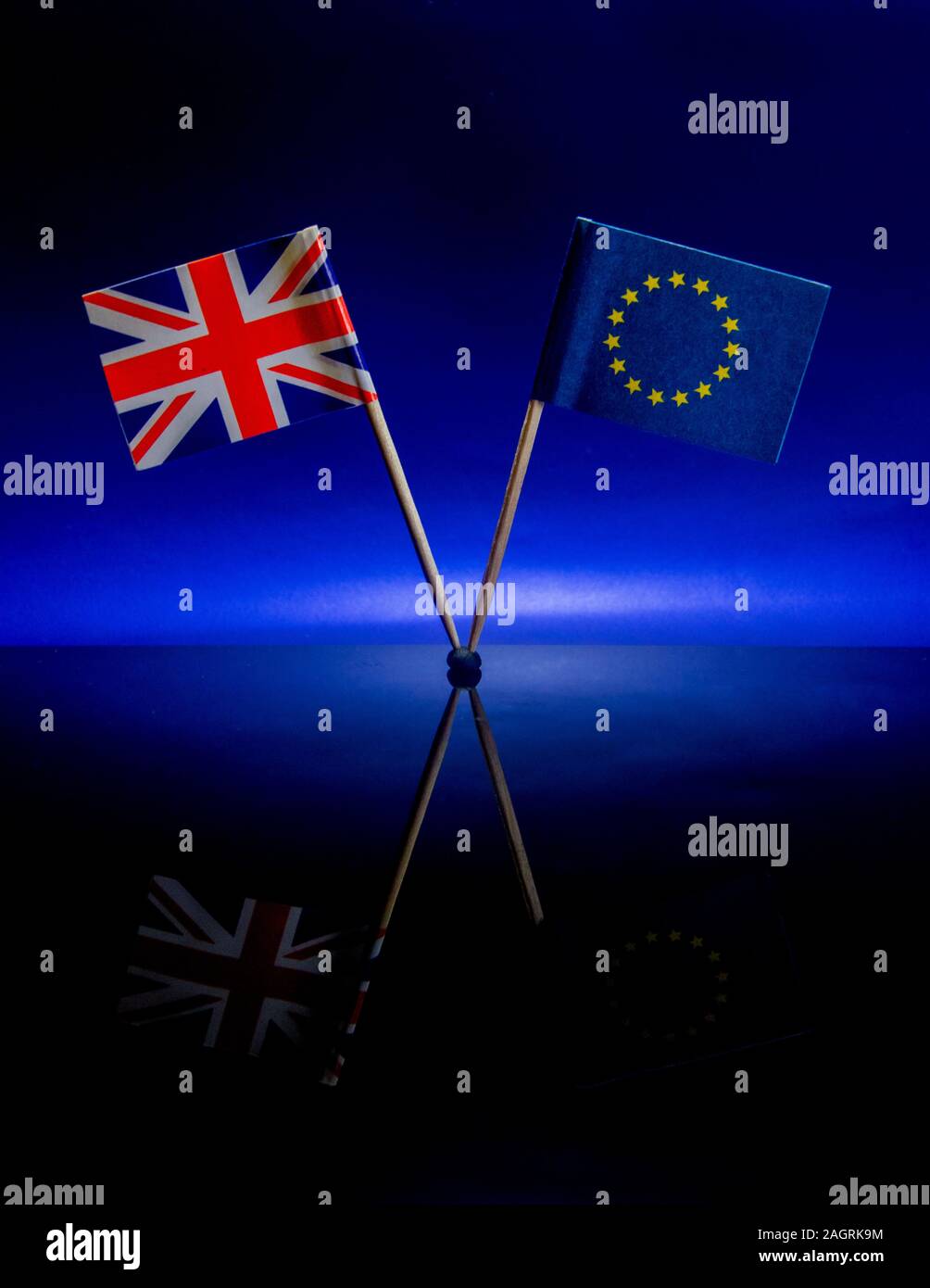 The British and EU flags stand together, against a sky blue background ...