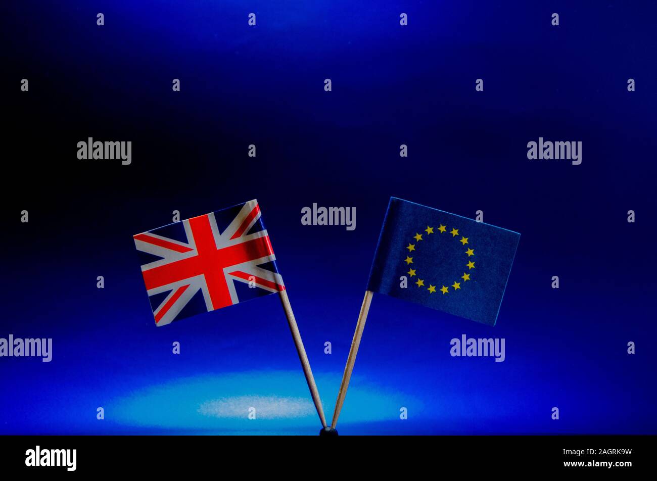 The British and EU flags stand together, against a sky blue background ...