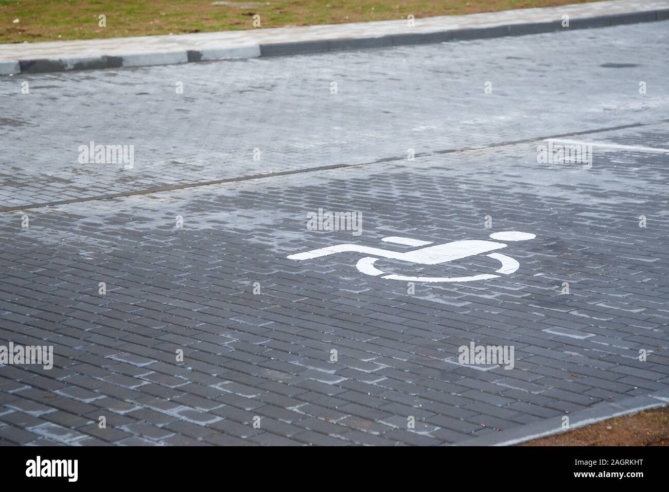 Wheelchair parking symbol on pavement hi-res stock photography and ...