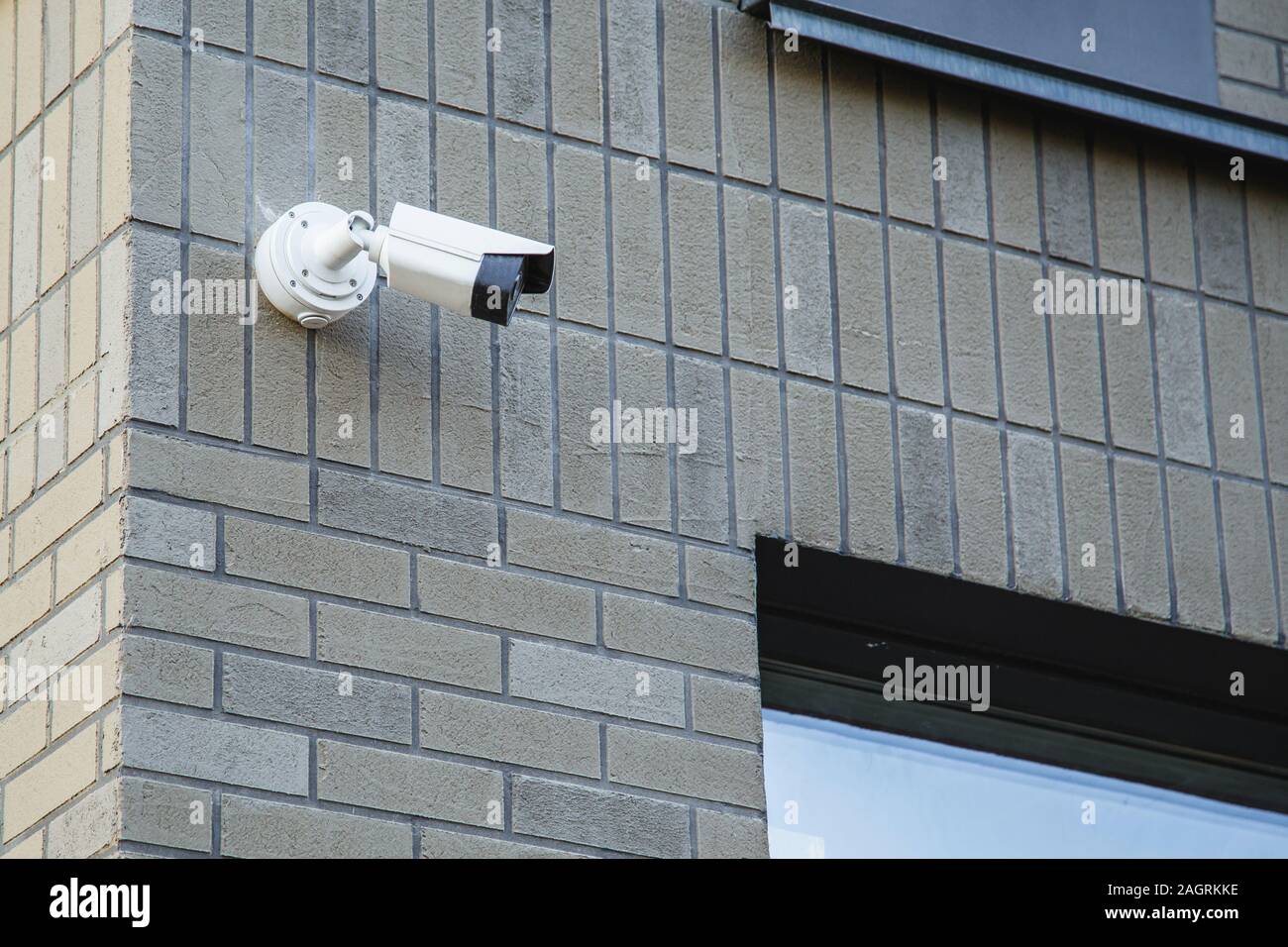 CCTV camera on facade of residential building Stock Photo - Alamy