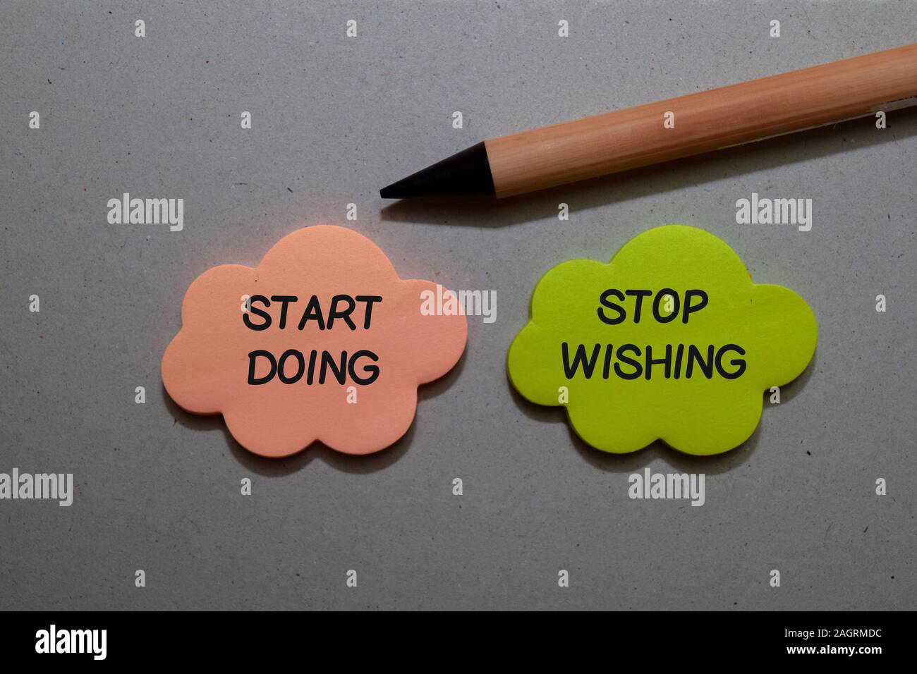 Start Doing or Stop Wishing write on sticky notes isolated on Office ...
