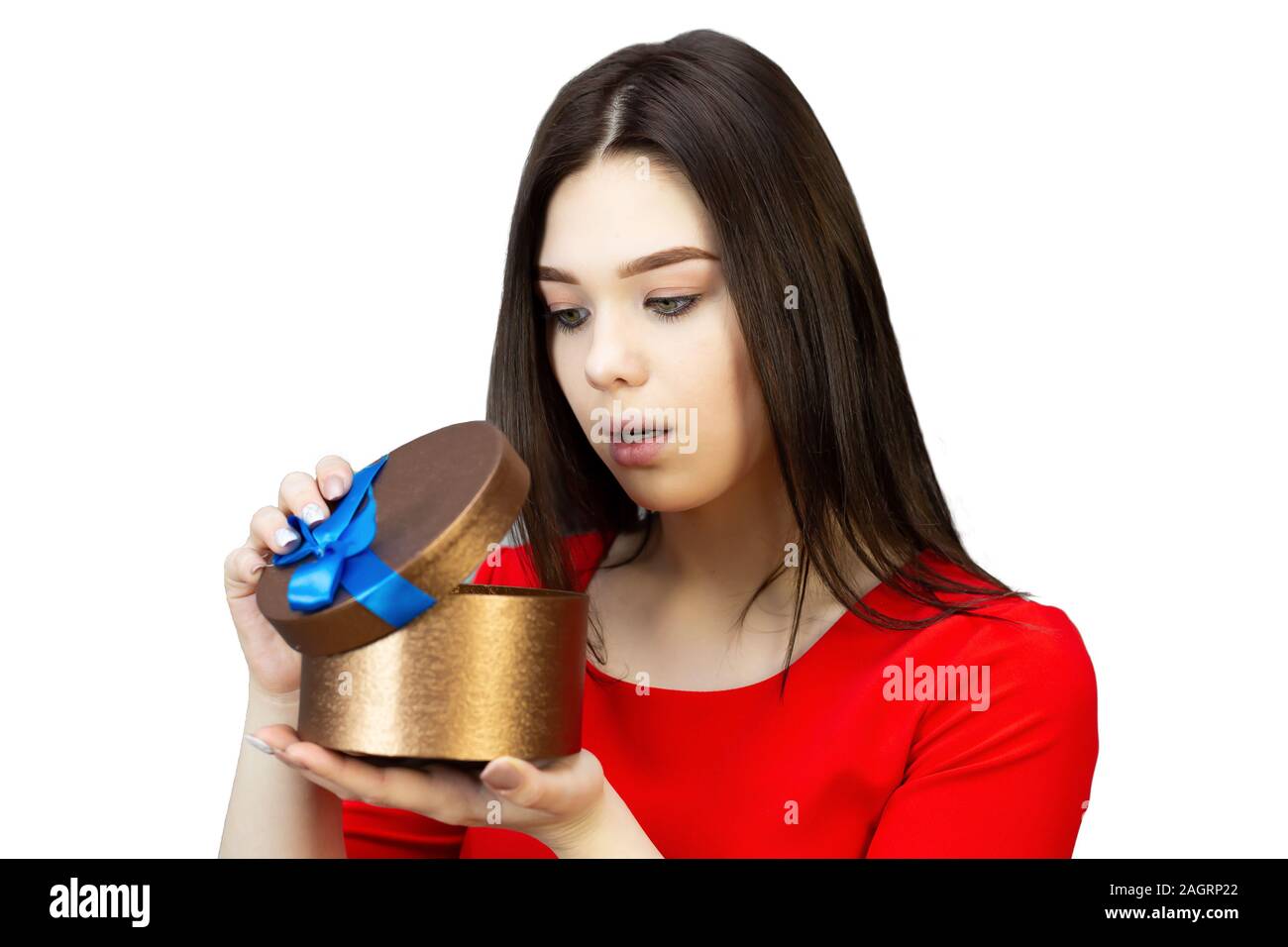 A teenager girl looks in surprise with disappointment and ...