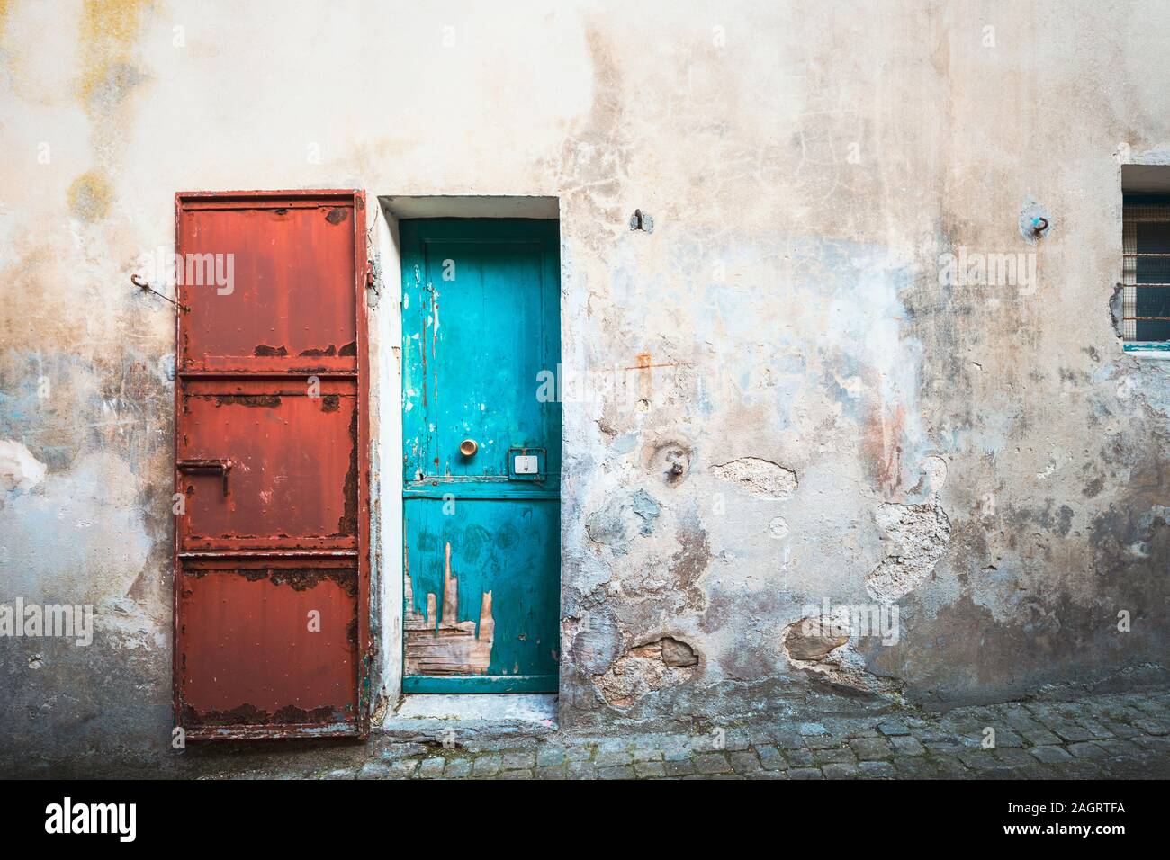 Doors blue and red, old building front view Stock Photo - Alamy