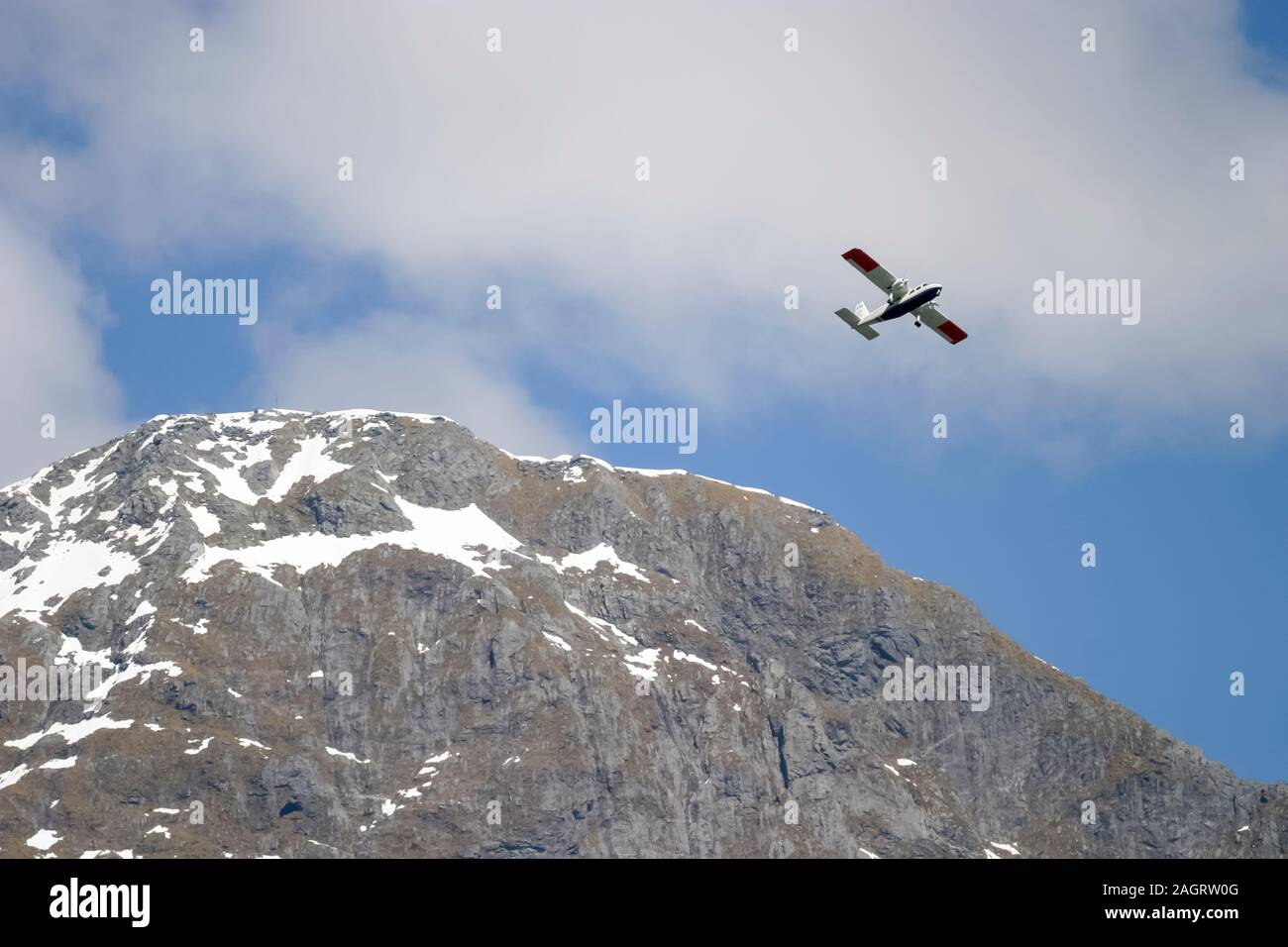Light aircraft flying over the Southern Alps, South Island, New Zealand ...