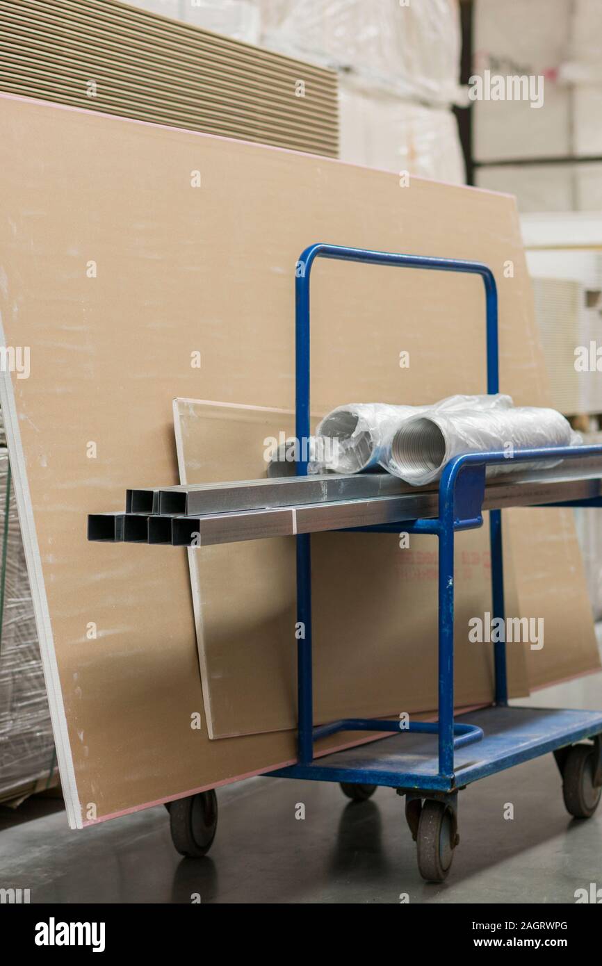 Trolley in a hardware store loaded with construction materials. Repair ...