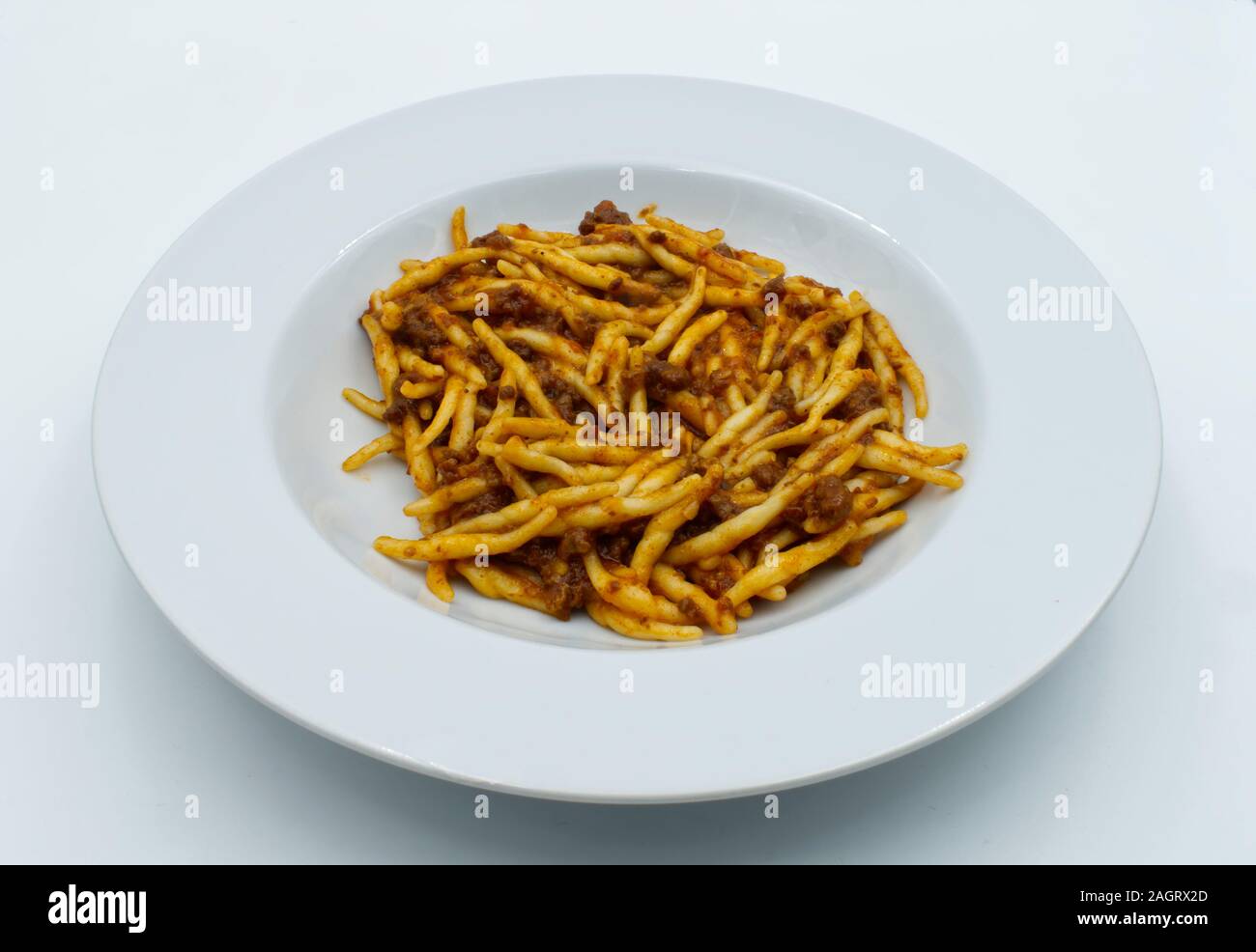 Trofie, traditional italian pasta, with beef in ragu bolognese. White ...