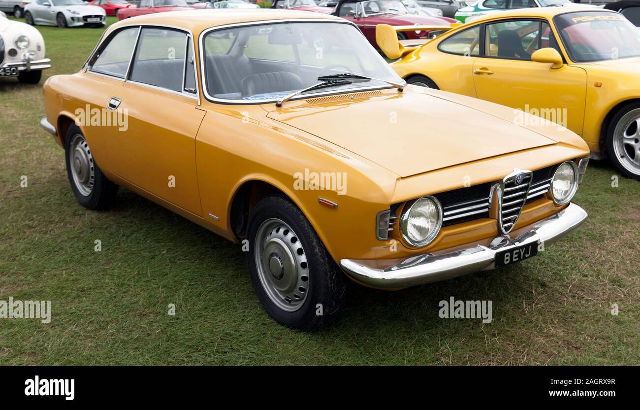 Three-quarters front view of a Yellow, 1967, Alfa Romeo Giulia Sprint ...