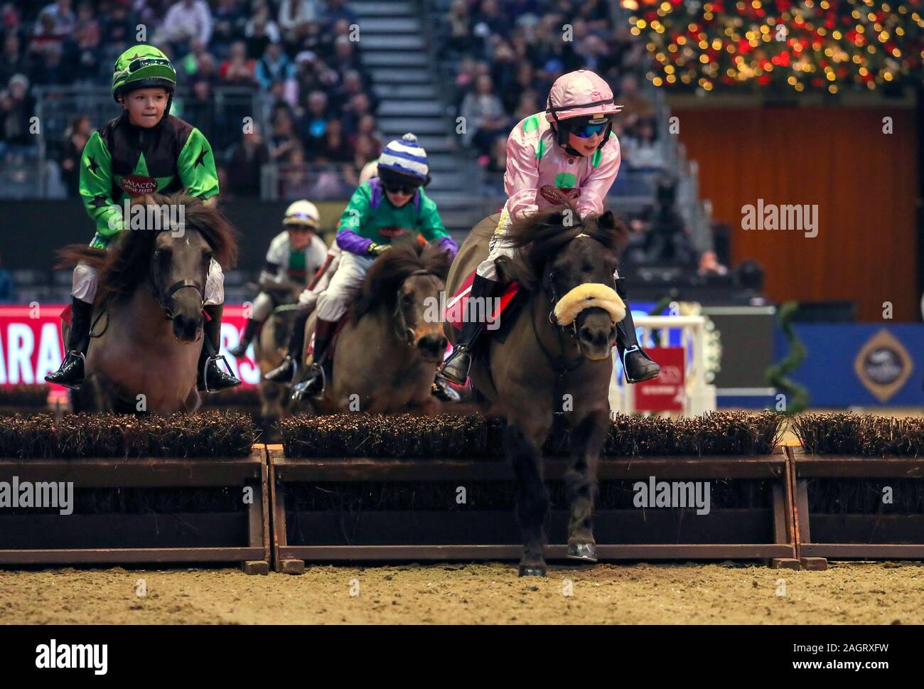 Riders compete in the Shetland pony Grand National during day six of ...