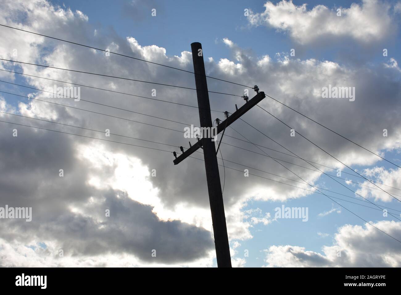 Utility poles against a clear blue sky Stock Photo - Alamy