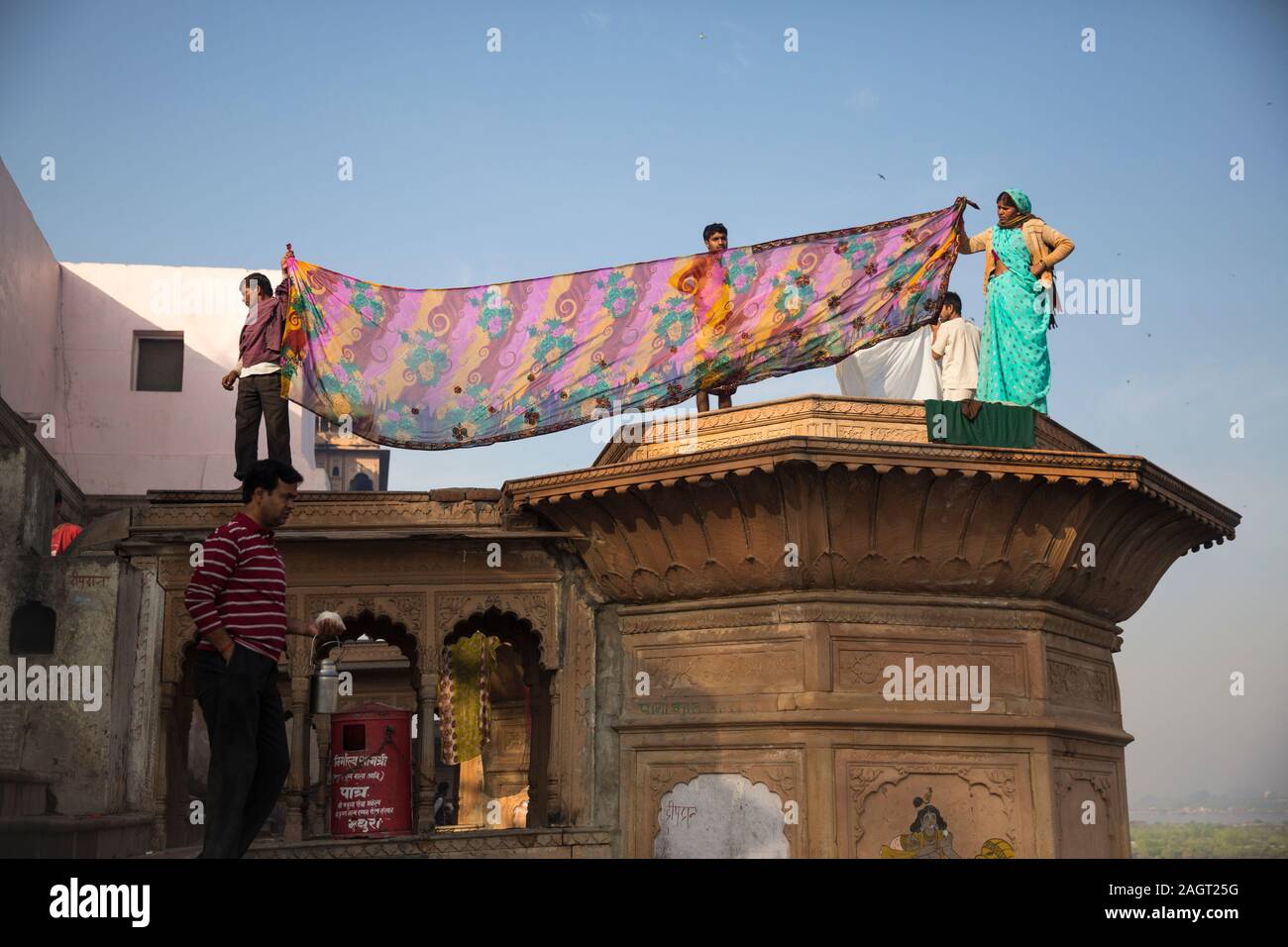 People drying a sari in the ghats of Vrindavan. India Stock Photo - Alamy