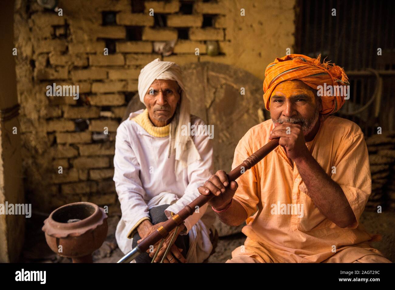 Man smoking from a pipe. Vrindavan, India Stock Photo - Alamy