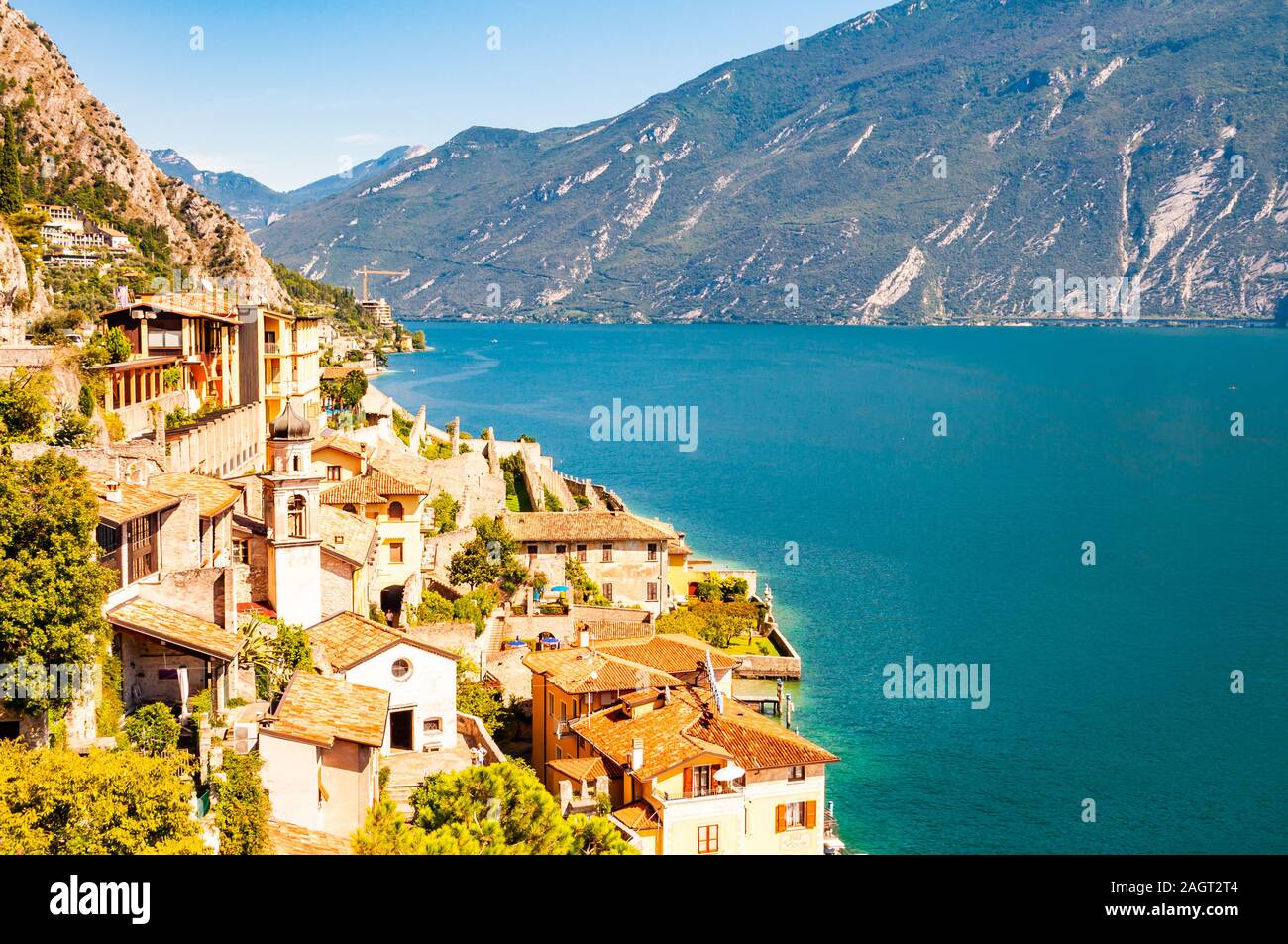 Limone Sul Garda cityscape on the shore of Garda lake surrounded by ...