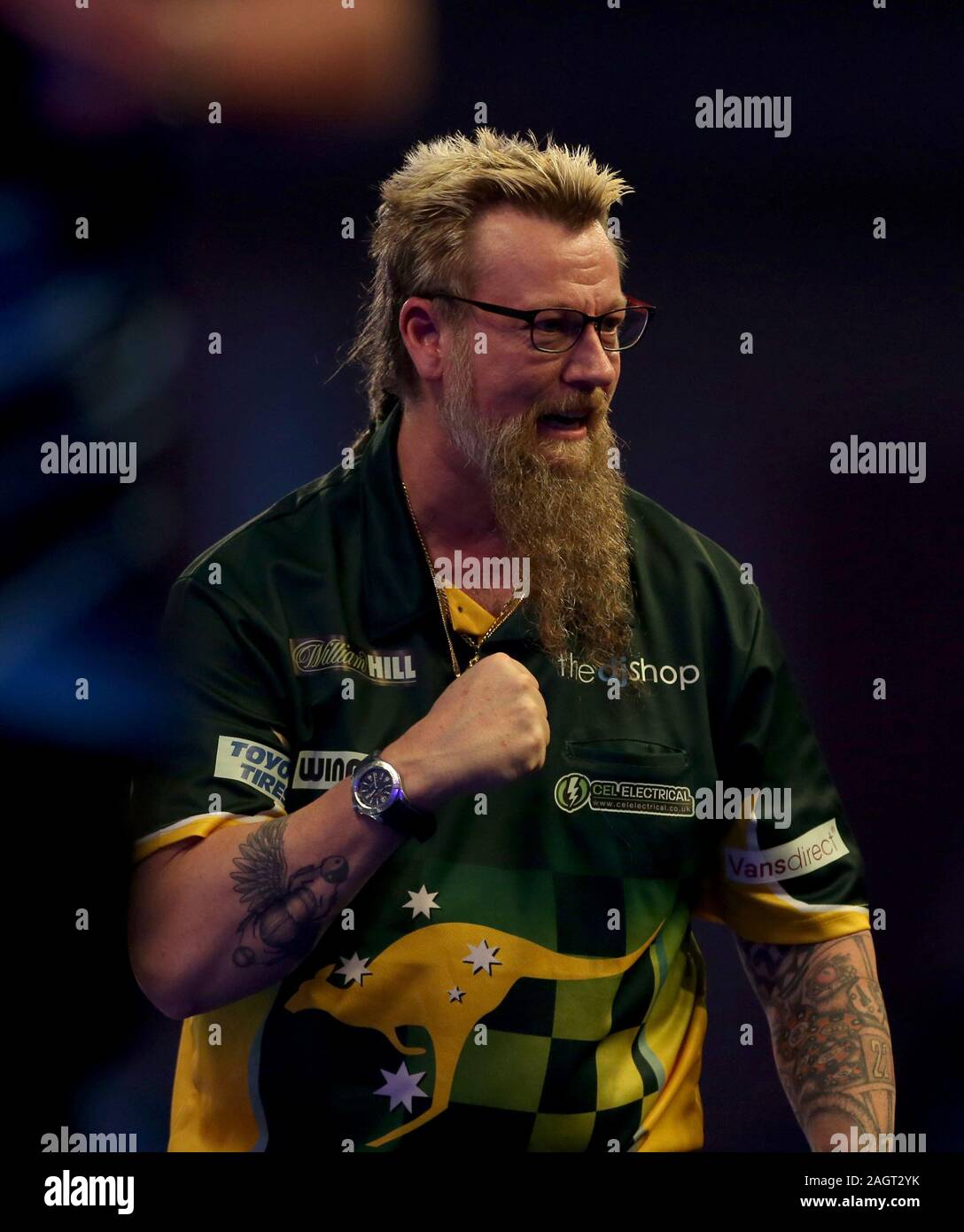 Simon Whitlock celebrates winning during day nine of the William Hill ...