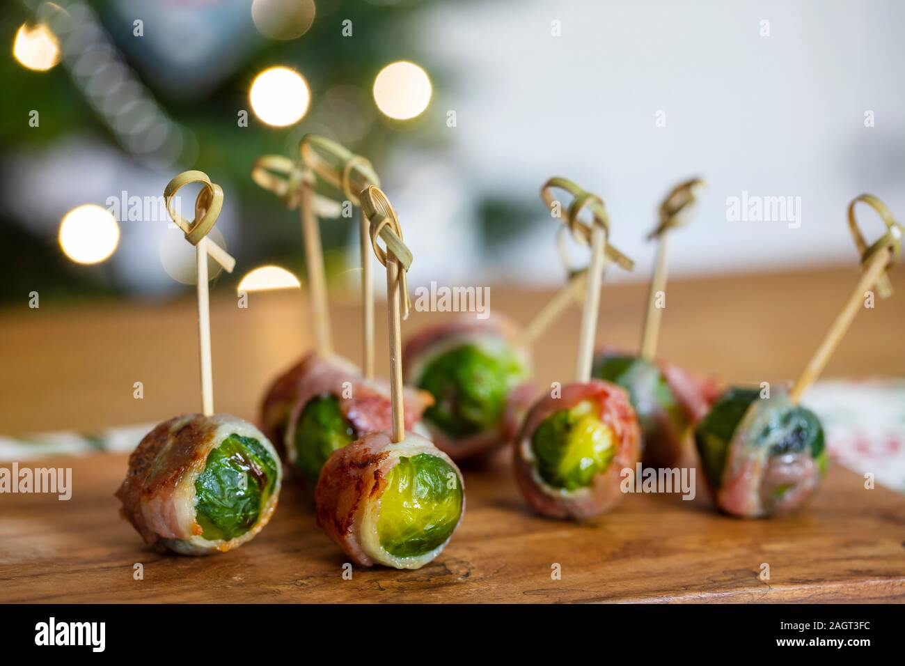 Christmas canapes, brussells sprouts wrapped in bacon Stock Photo - Alamy