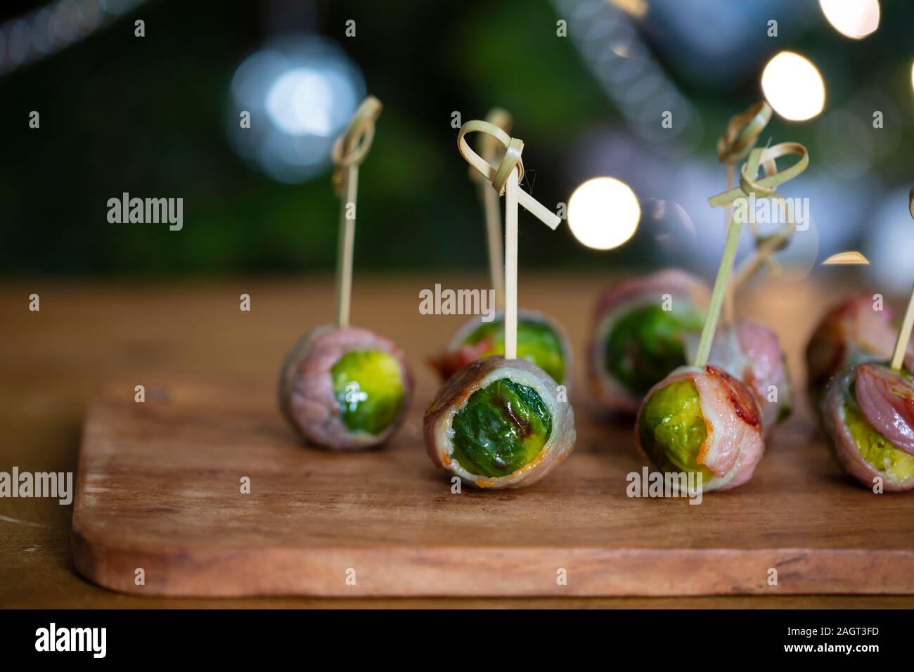 Christmas canapes, brussells sprouts wrapped in bacon Stock Photo - Alamy