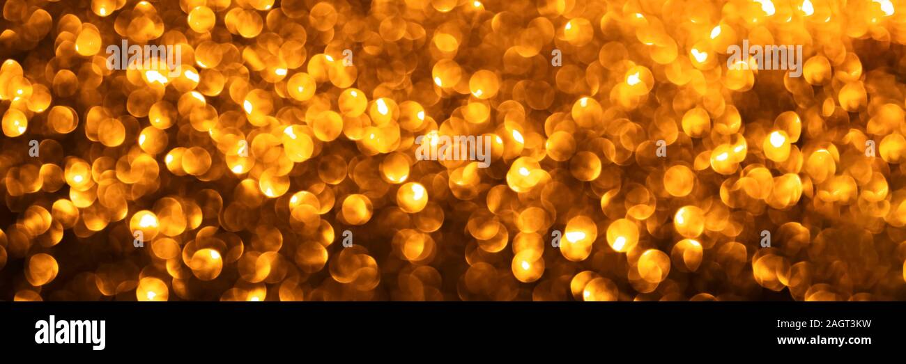 Abstract yellow saffron defocused bokeh glitter sparkle confetti burst ...