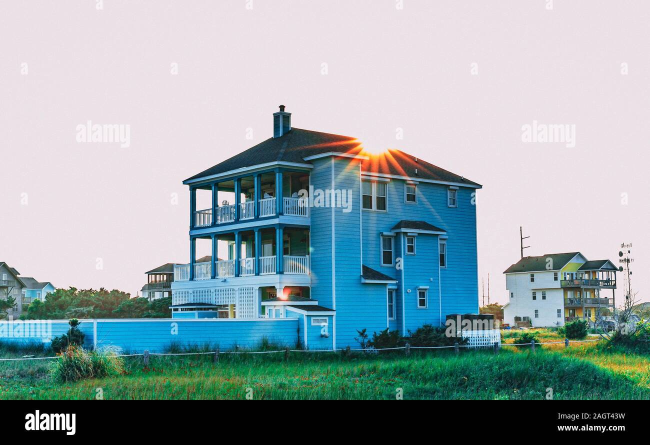 Summer sun setting behind an Outer Banks North Carolina vacation beach ...