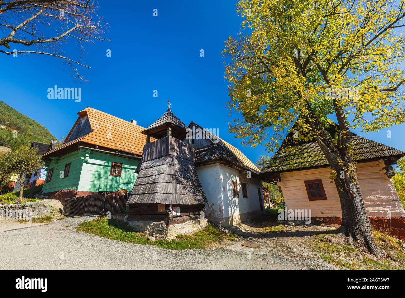 Colorful wooden houses in Vlkolinec village in northern Slovakia. A ...