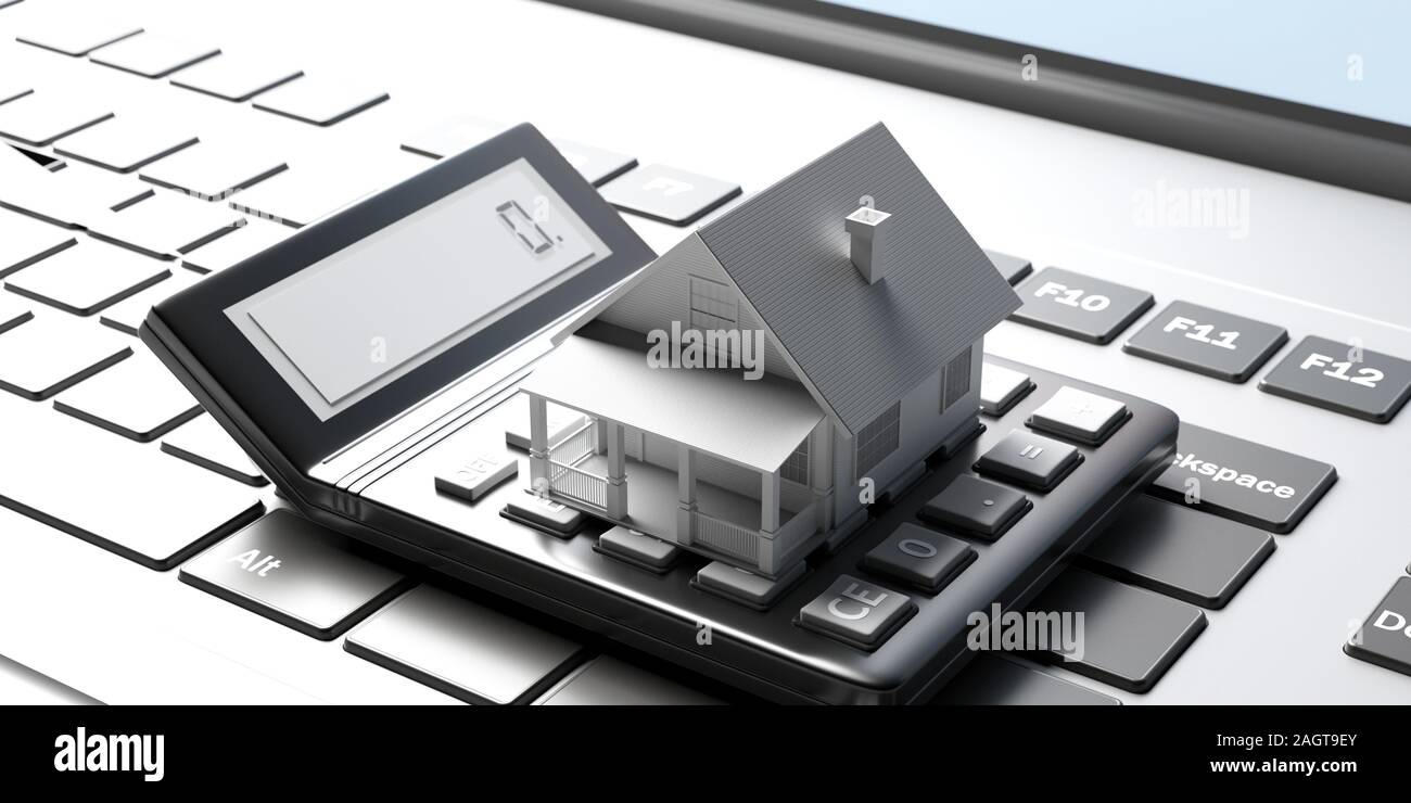 House model on a calculator on a computer laptop. Real estate ...