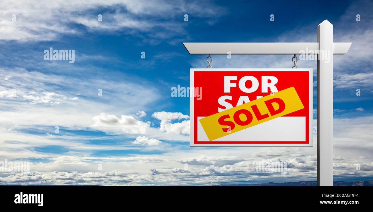 Sold sign over for sale sign against blue sky background. Real estate ...