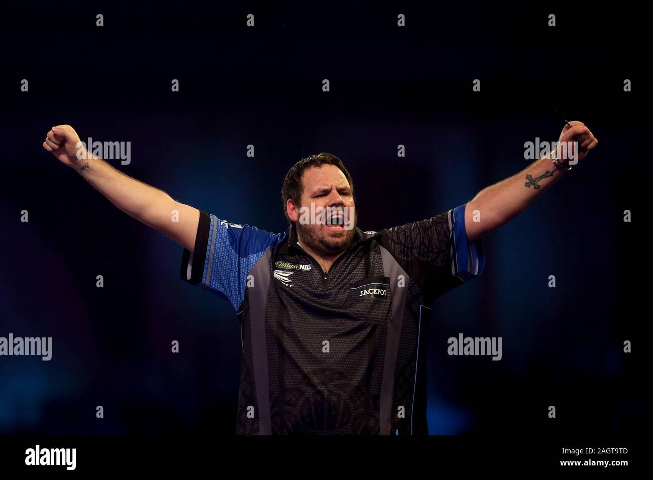 Adrian Lewis celebrates winning during day nine of the William Hill ...