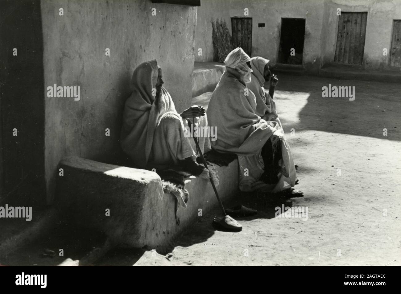 Tuareg people sitting in the street of Gadames, Libya 1940s Stock Photo ...