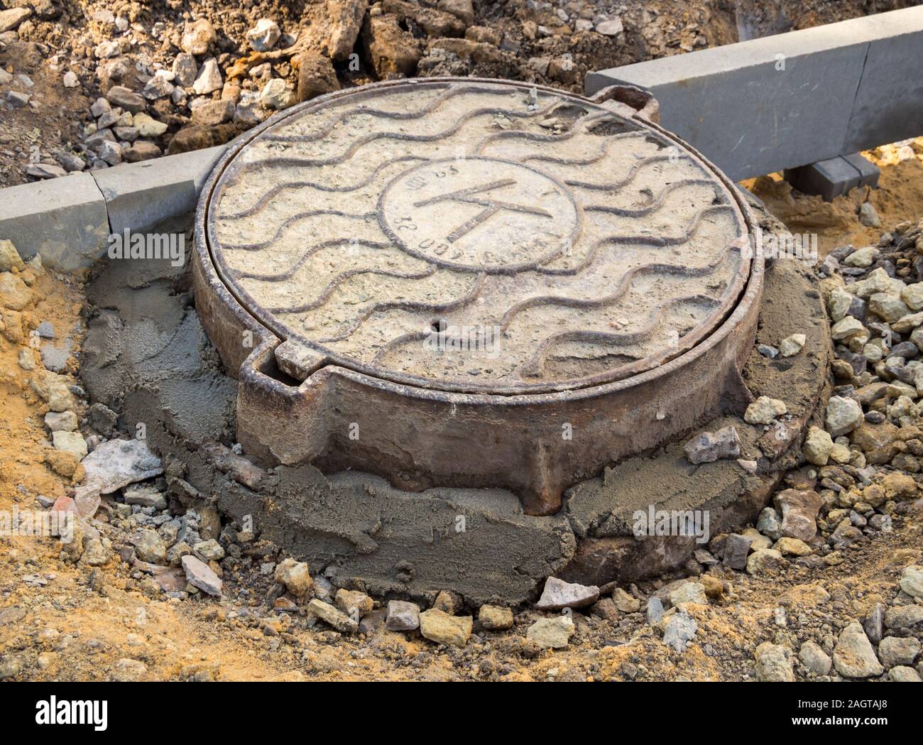 Installation of a sewer hatch during pavement installation Stock Photo ...