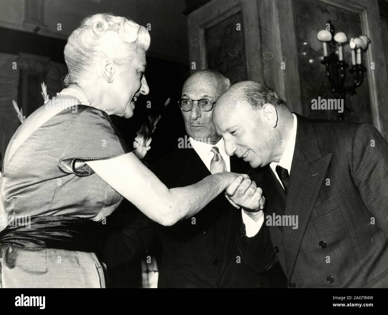 Italian PM Mario Scelba kissing the hand of Susanna Agnelli, Rome ...