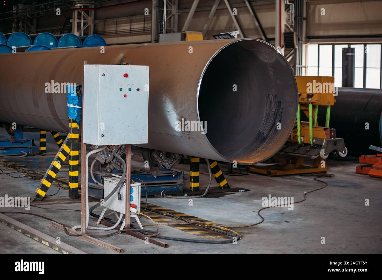 Pipe factory production line, pipe on roller conveyor Stock Photo - Alamy