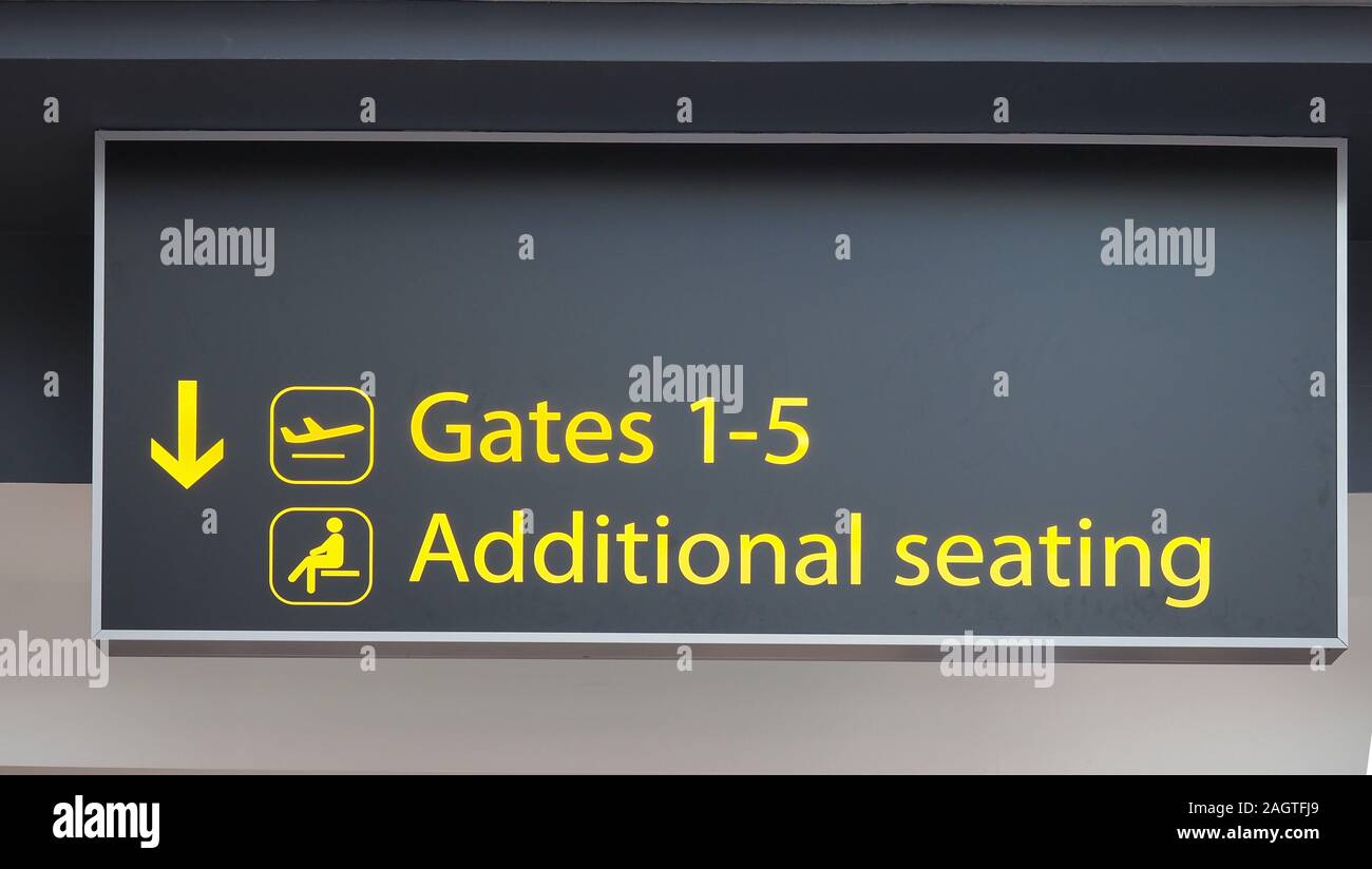 Gates 1 5 additional seating sign at airport Stock Photo - Alamy