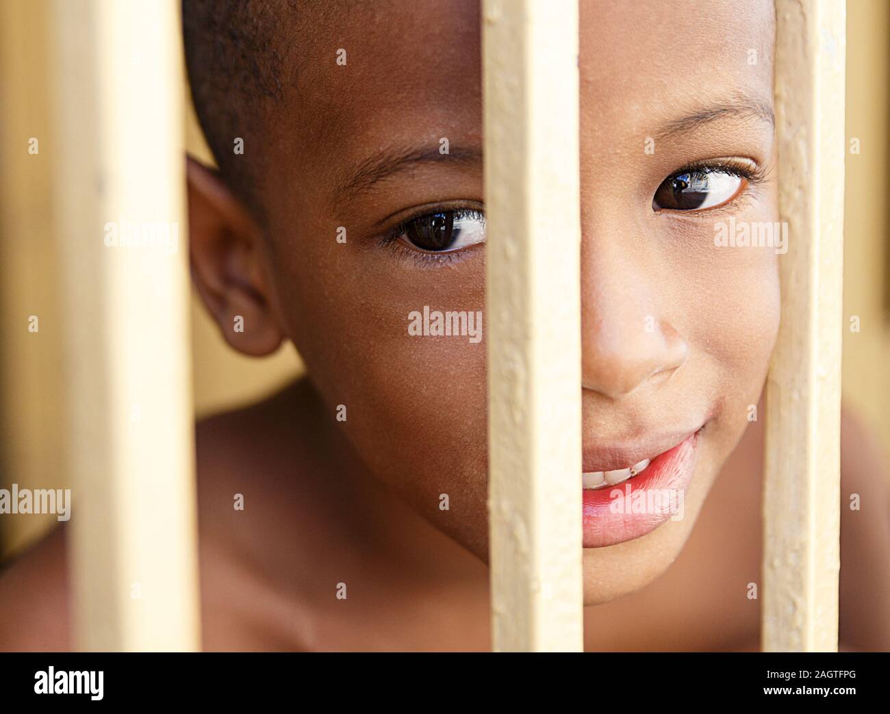 Children playing behind a fence hi-res stock photography and images - Alamy