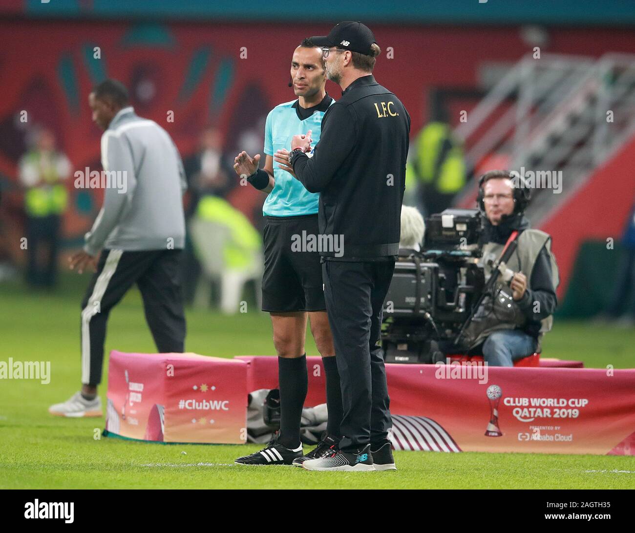 Liverpool manager Jurgen Klopp (right) speaks with fourth official ...
