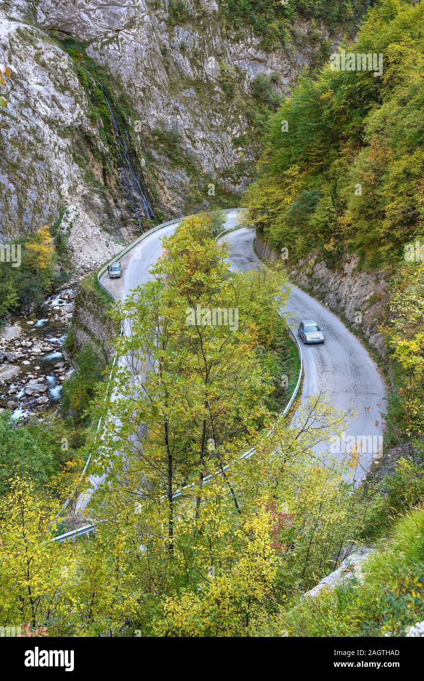 Cars negotiating a switchback in the Rugova canyon, one of Europe's ...
