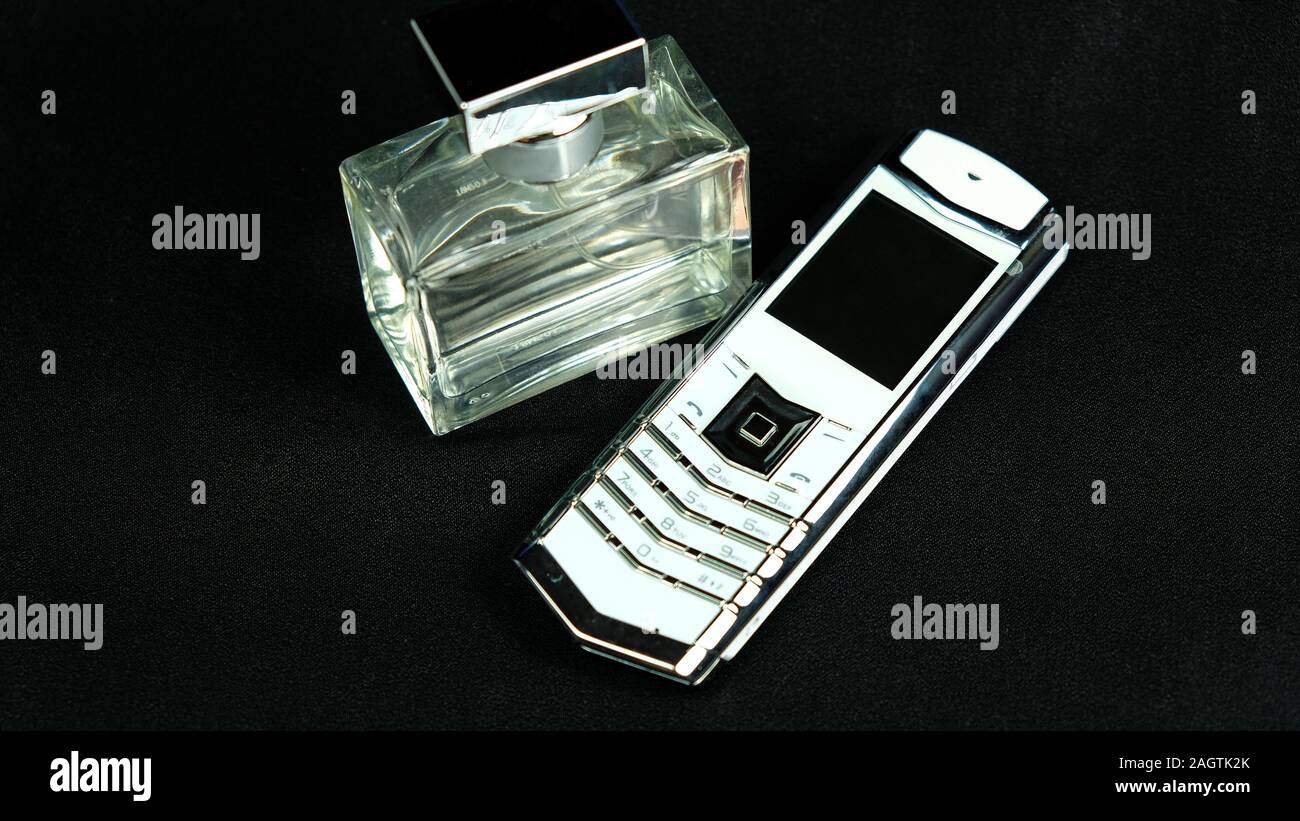 Luxury moile phone and luxury perfume Stock Photo - Alamy