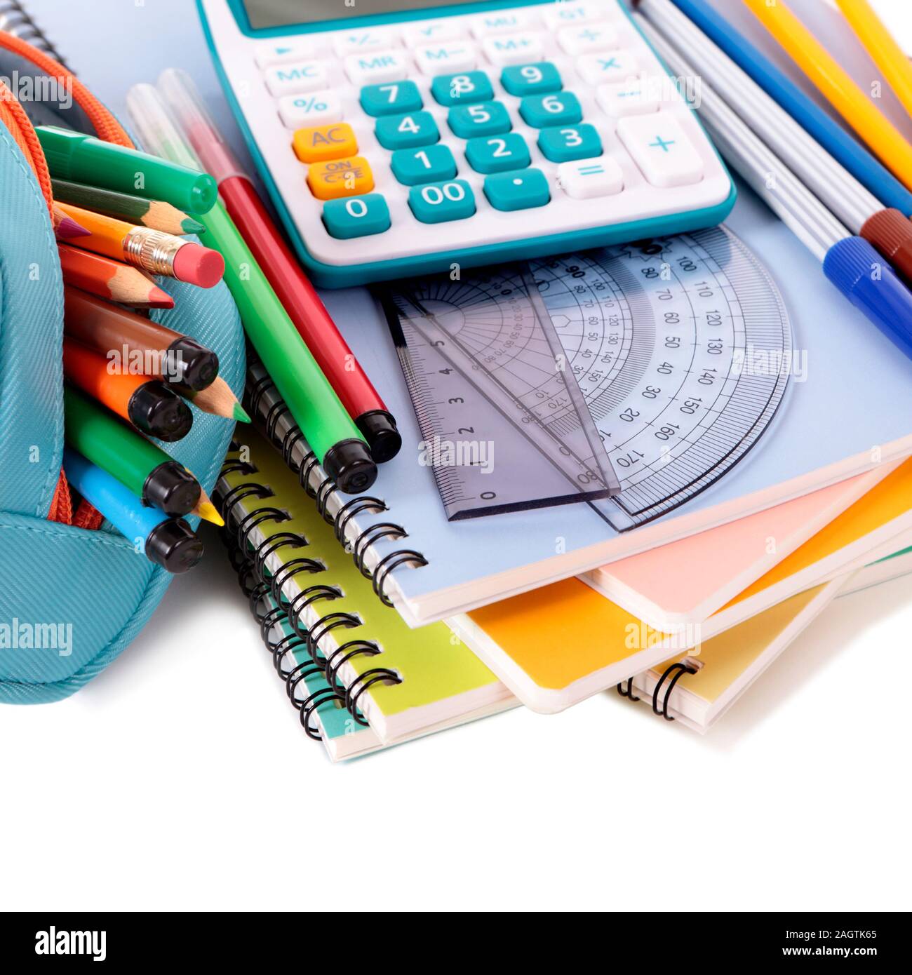 Various school supplies including notebooks, calculator and pencil case ...
