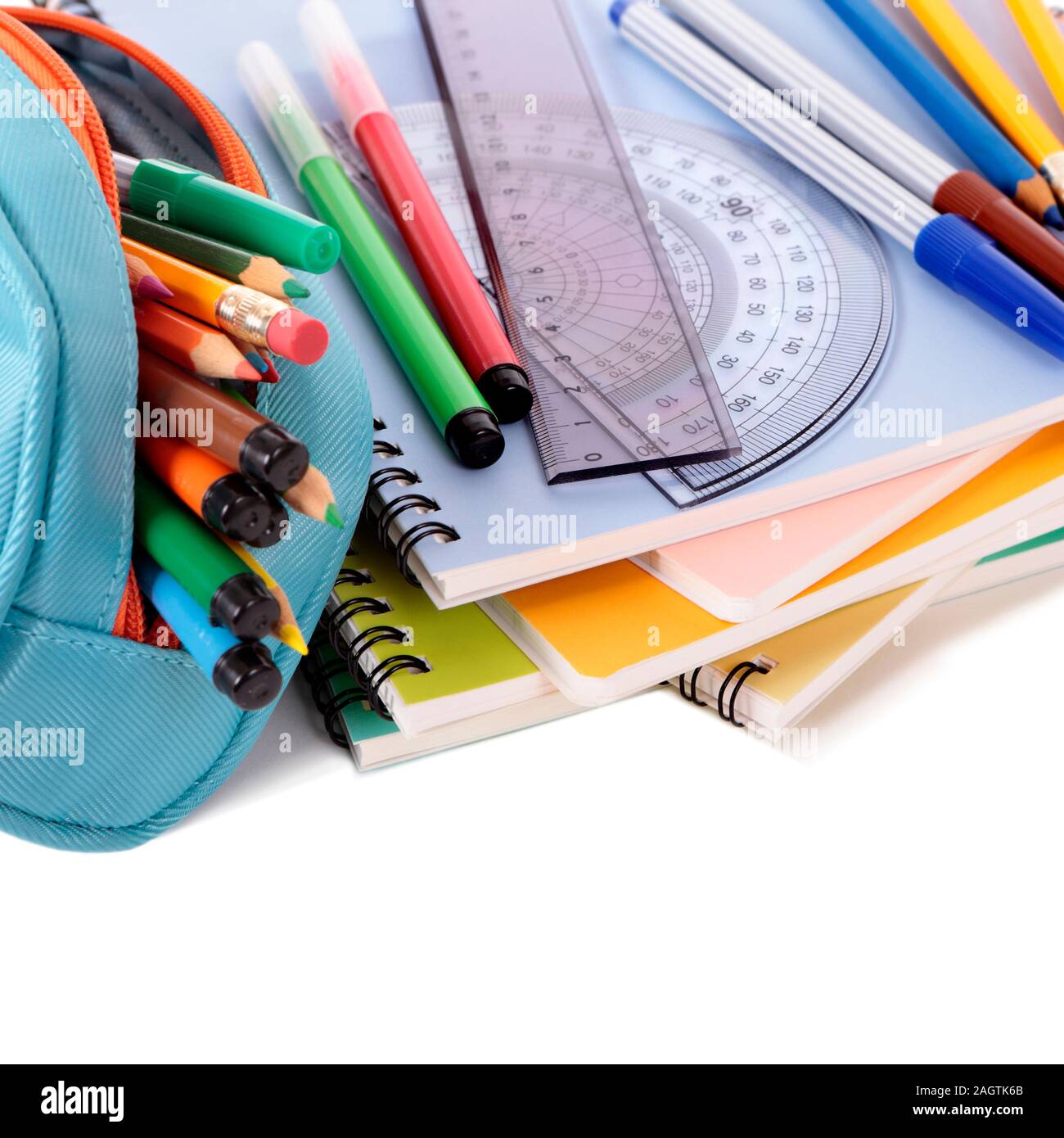 Various school supplies including notebooks and pencil case isolated ...