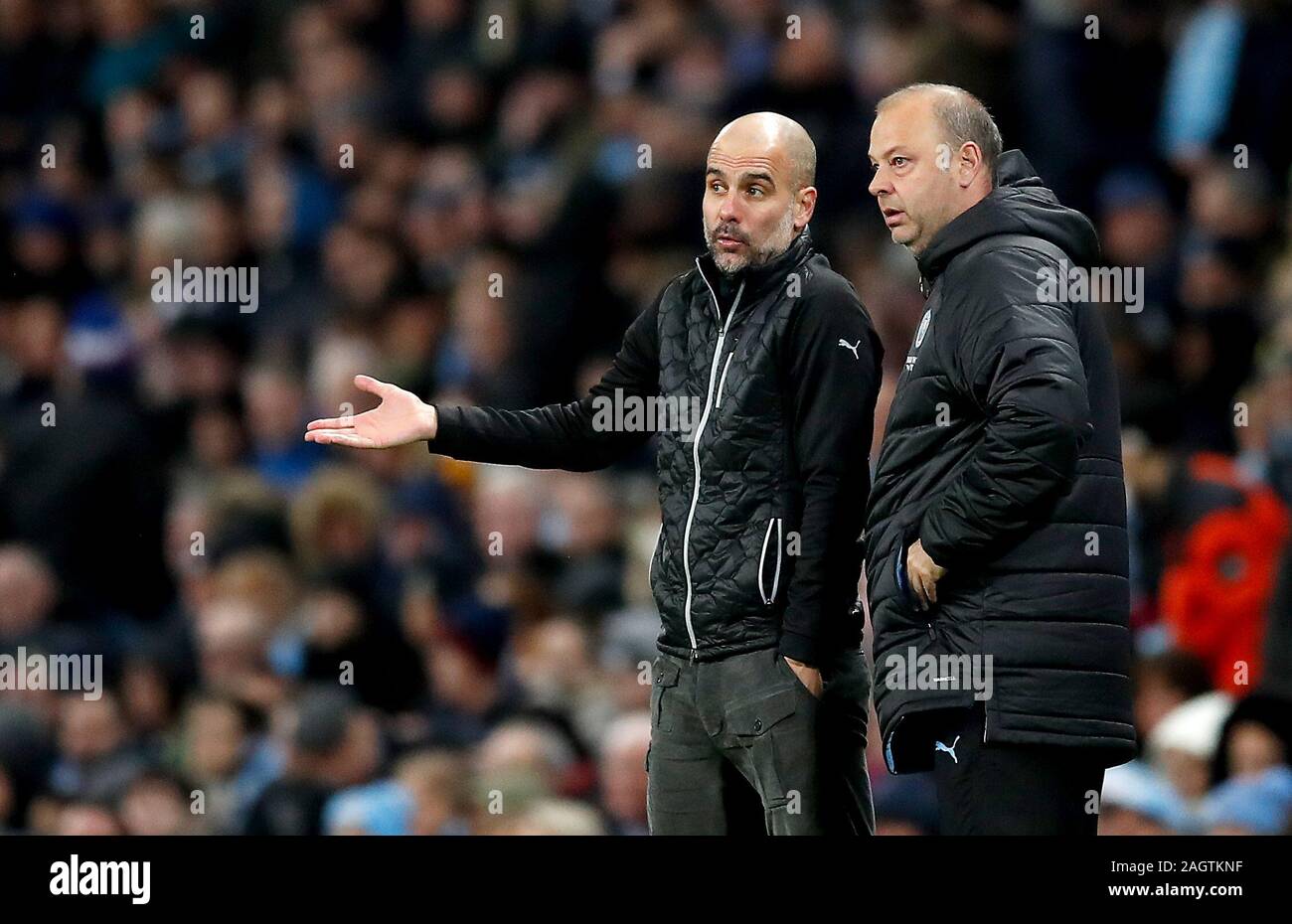 Manchester City manager Pep Guardiola (left) with assistant Rodolfo ...