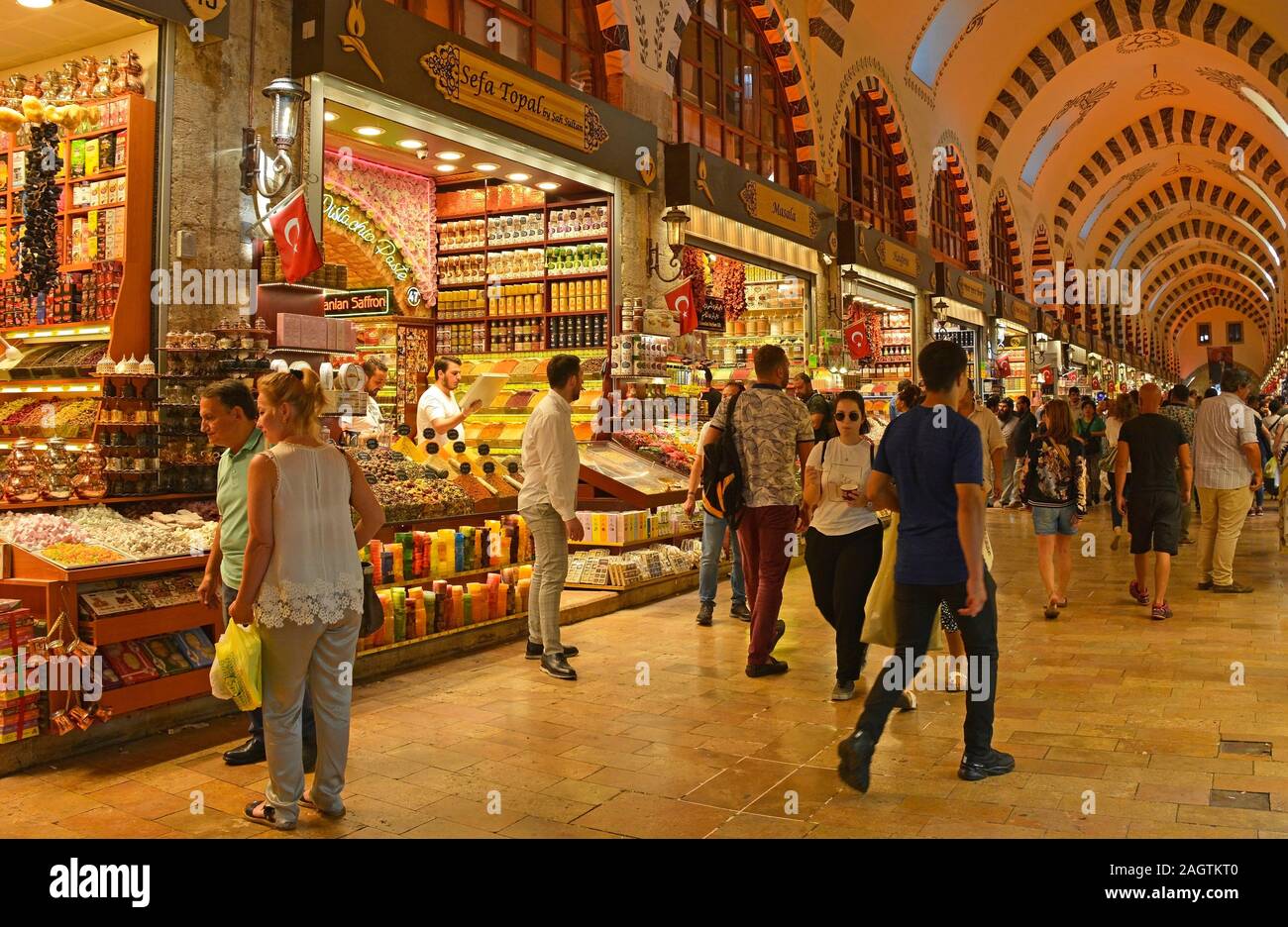 Istanbul, Turkey - September 6th 2019. Tourists walk past shops selling ...